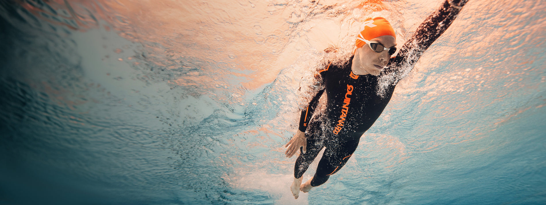 Wetsuits and Swimskins | Quintana Roo Tri